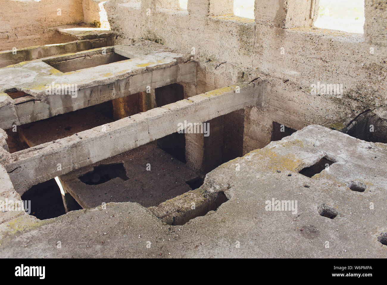 The destroyed big concrete building in a foggy haze. The remains of the ...