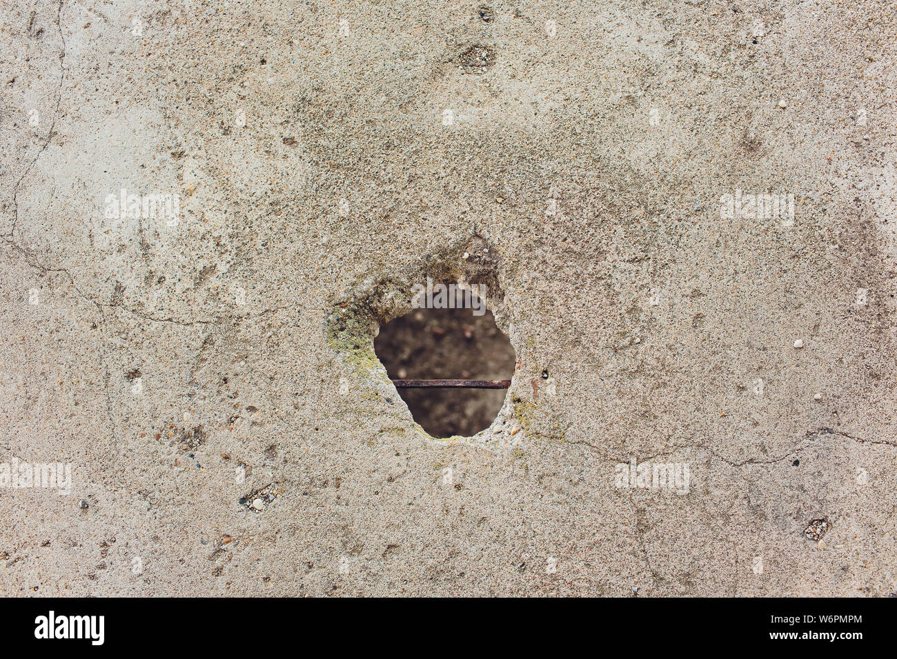 Cracks holes on the cement wall Caused by drilling To put the plumbing ...