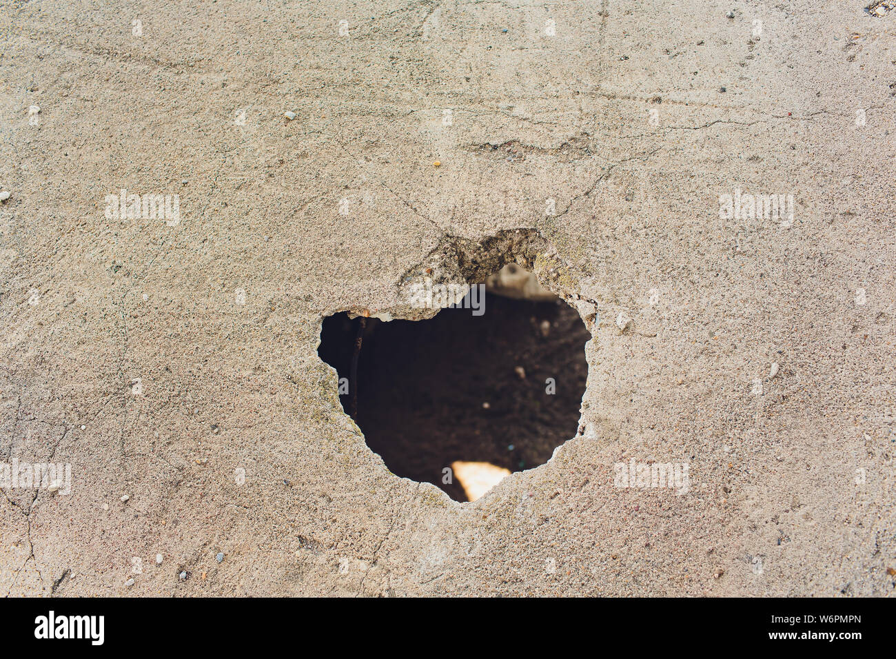 Cracks holes on the cement wall Caused by drilling To put the plumbing ...