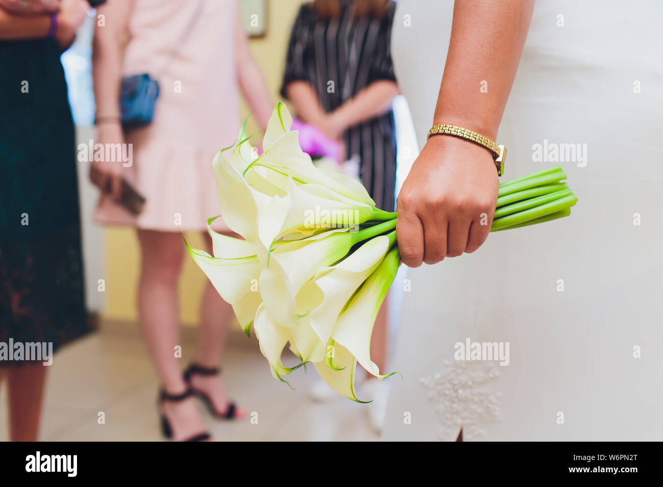 Woman hand holding flowers. Bouquet of flowers for congratulations ...