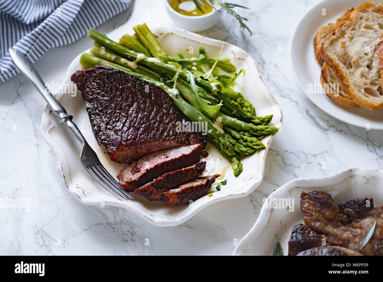 Cooked black angus prime beef steak with asparagus and cream mustard ...