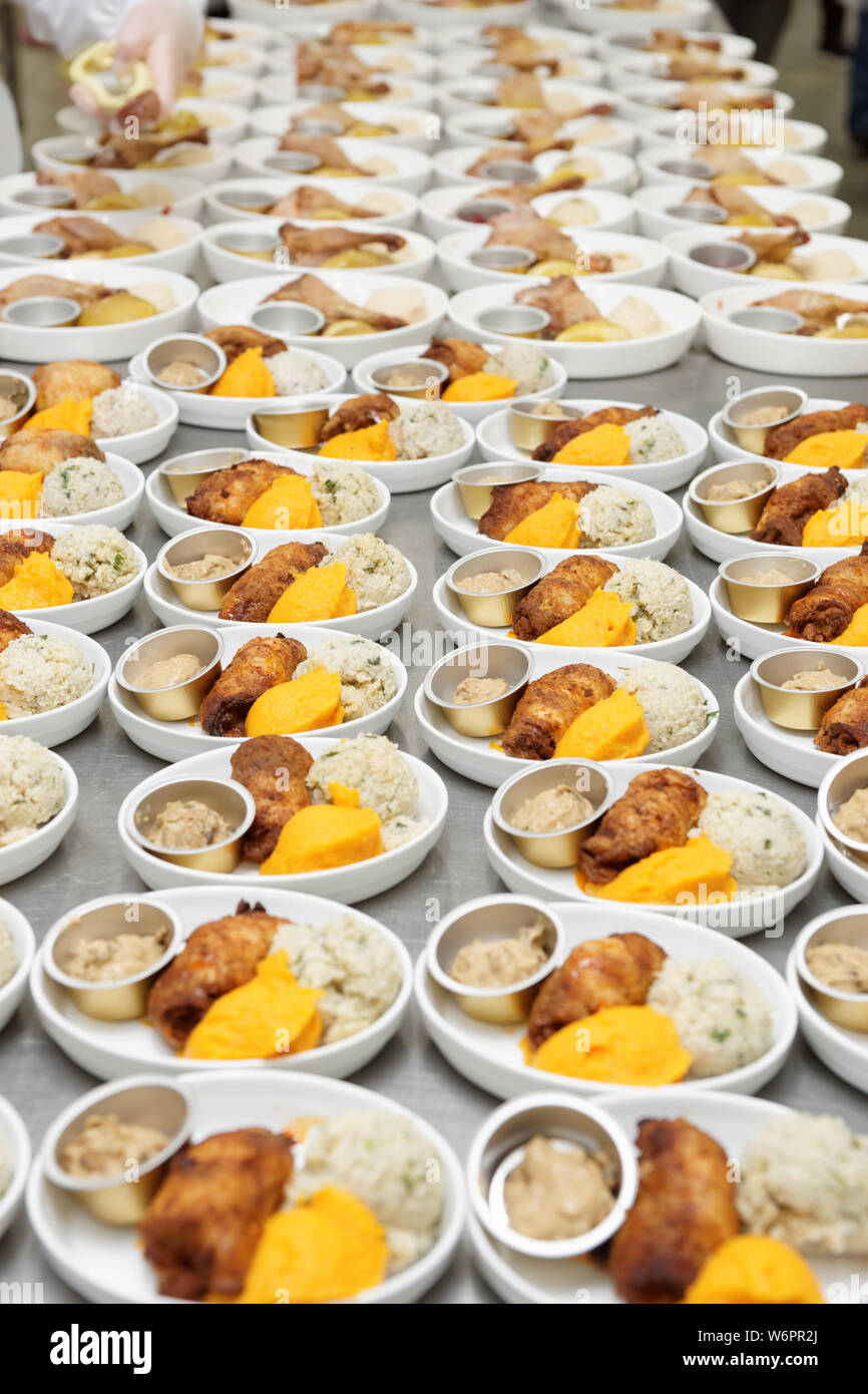 Many plates of airline food prepared in large-scale professional ...