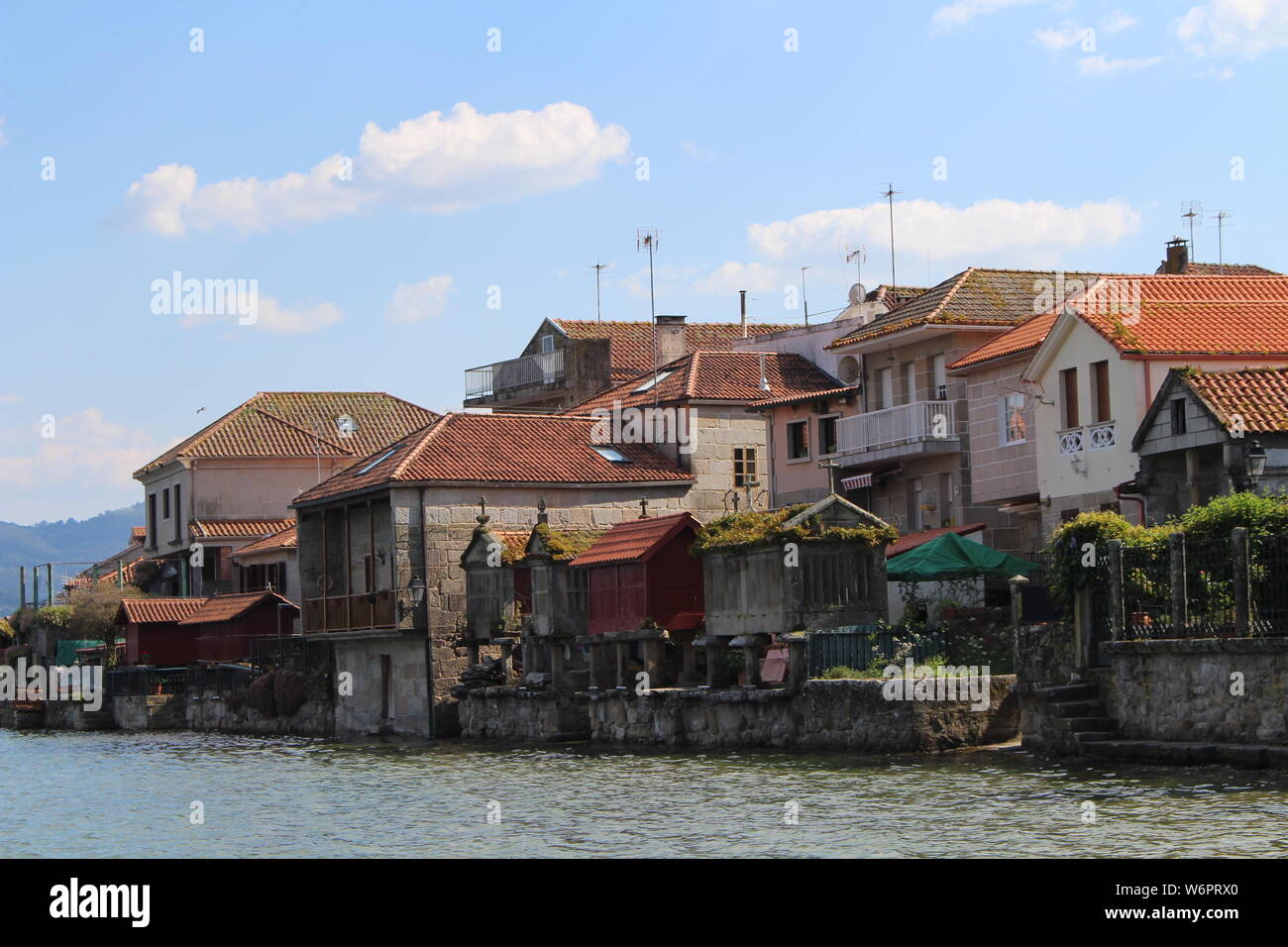 Beautiful village of Combarro in Spain unique for its horreos ...