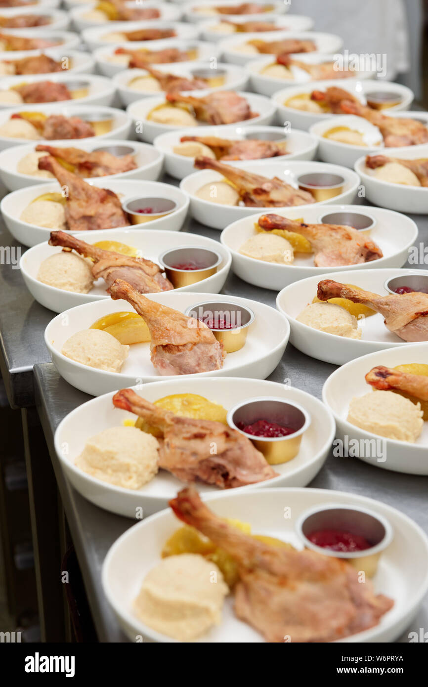 In-flight meals on table - chicken legs with mash and berry sauce Stock ...