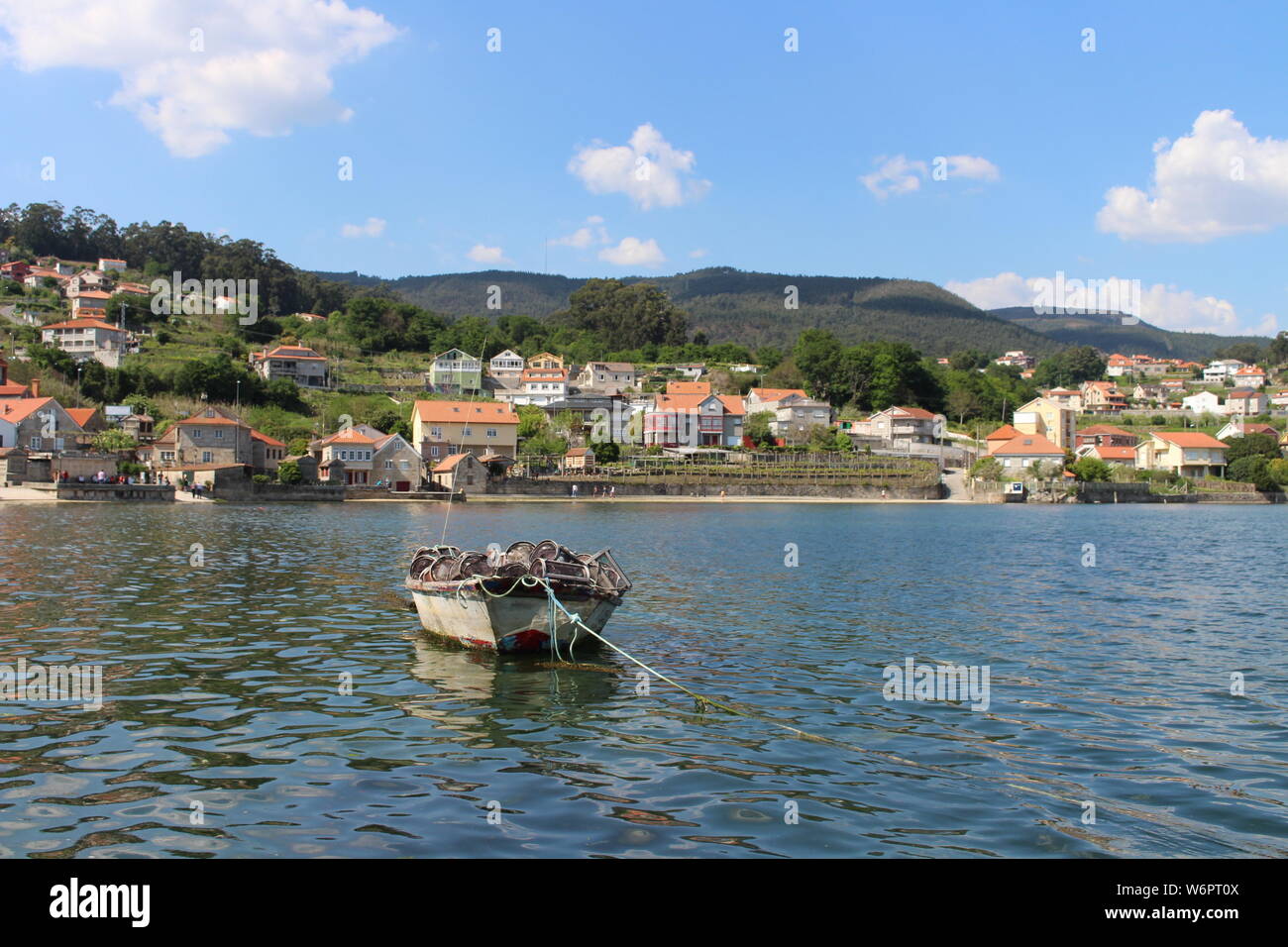 Empty and solitary boat on the seawater of a beautiful fisherman ...