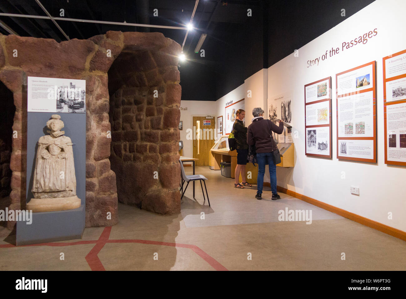 Tourists and visitors inside the Heritage Centre at the start of Exeter ...