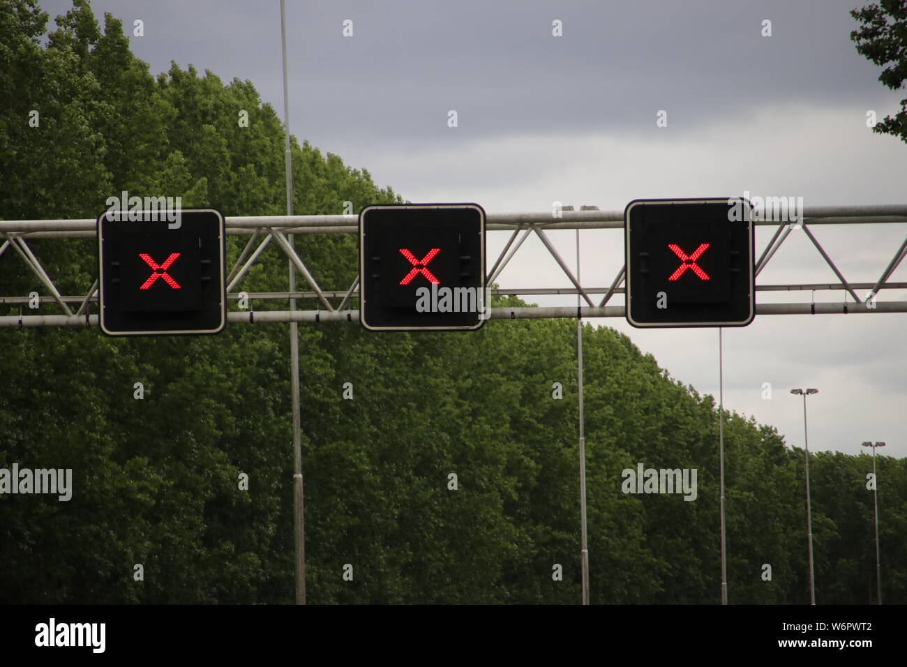 Red crosses above closed driving lanes on Highway A20 at Nieuwerkerk ...