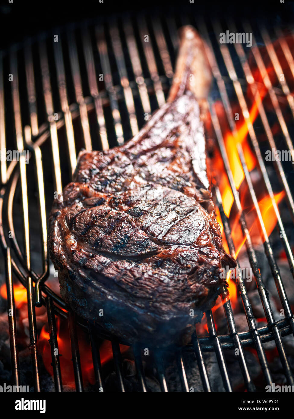 Angus beef tomahawk steak being grilled on a BBQ Stock Photo - Alamy