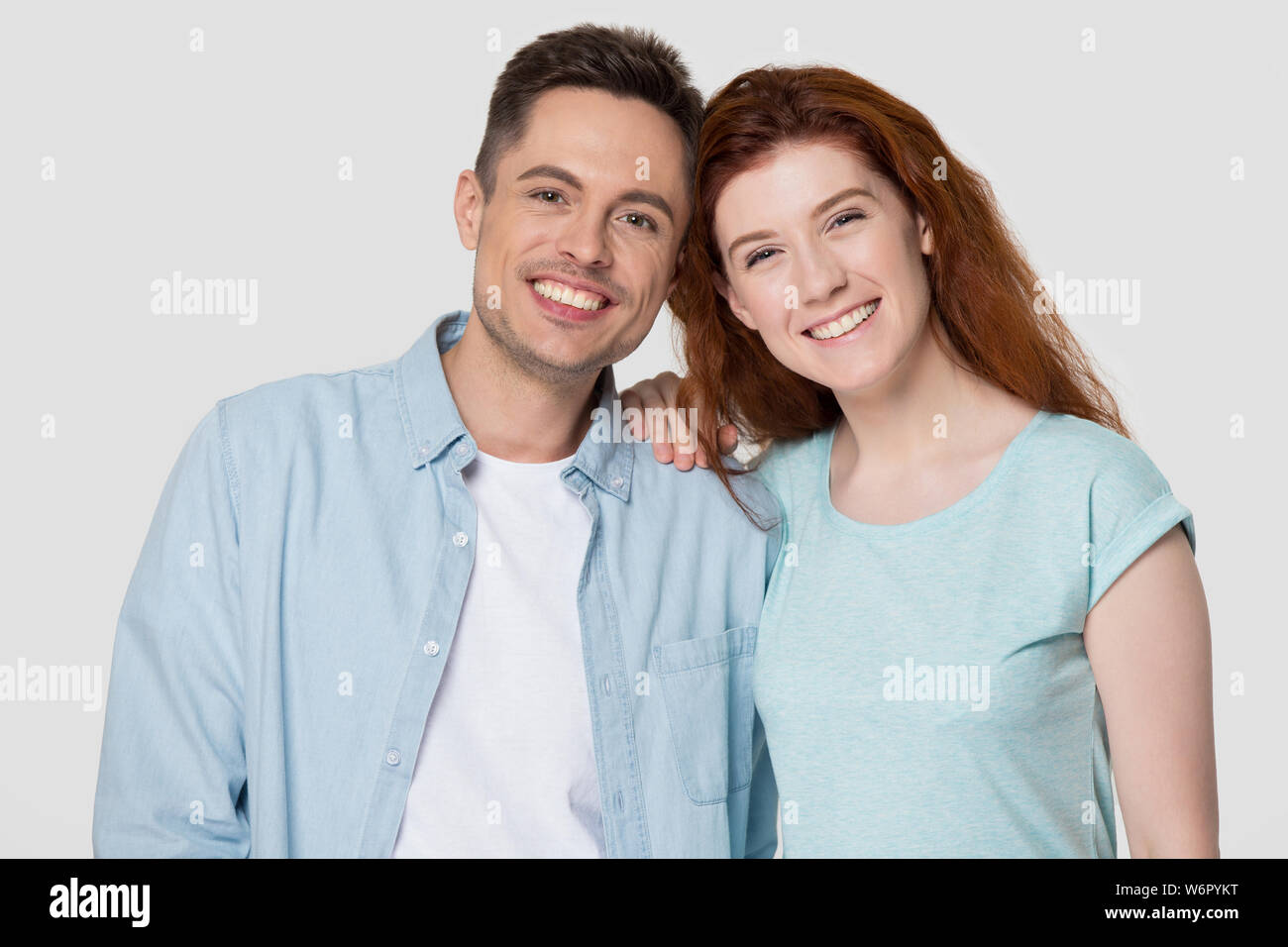 Head shot studio portrait happy attractive couple on grey background ...