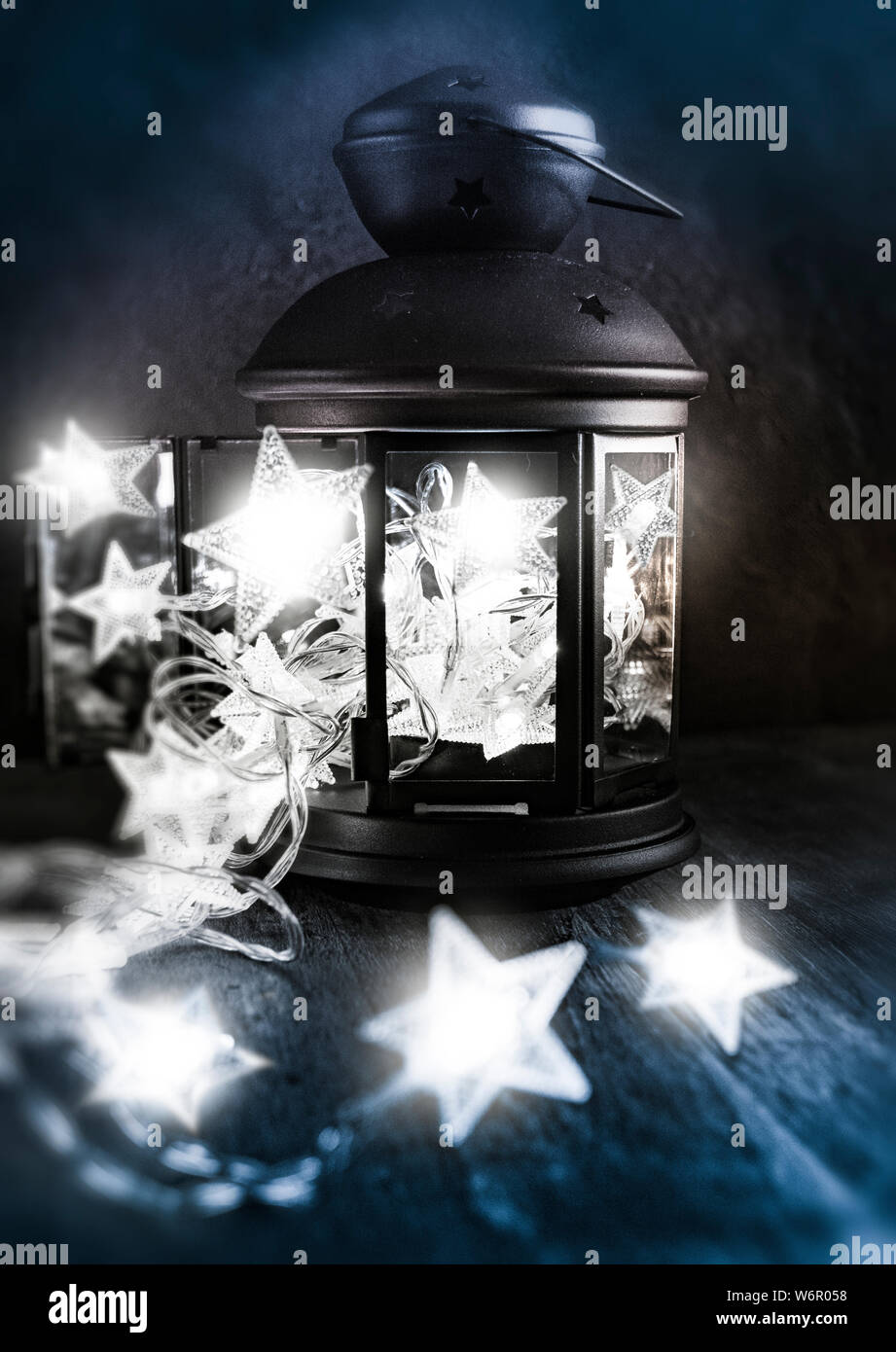 Christmas LED star lights pushed into a lantern to create an unusual ...