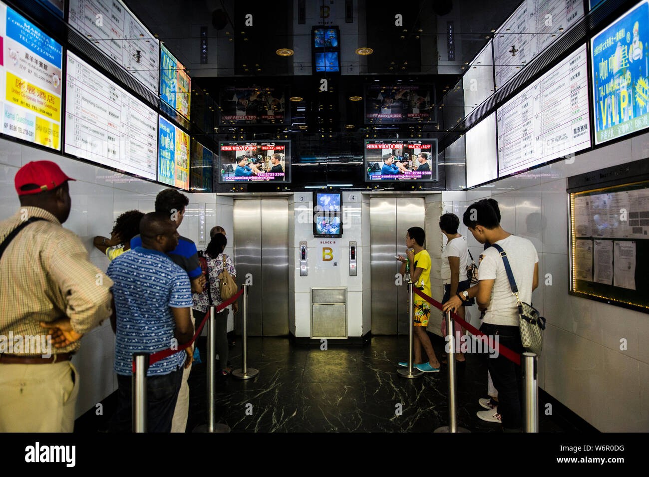 People waiting for the lift inside Chungking Mansions. Hong Kong Stock ...