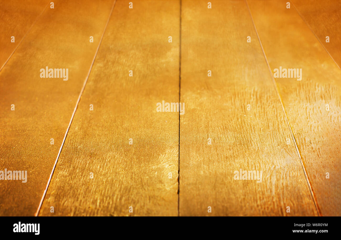 Gold background. Golden wooden painted rustic table texture with copy ...