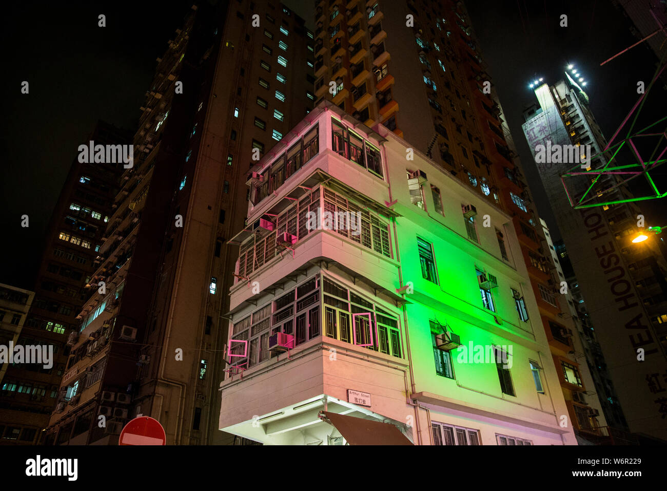 Green lit building at Arthur Street. Hong Kong Stock Photo - Alamy