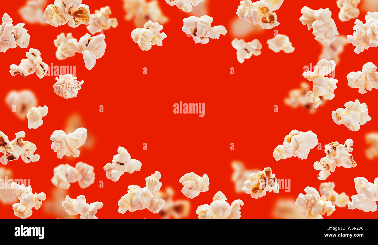 Popcorn frame with space for text, flying popcorn isolated on red ...