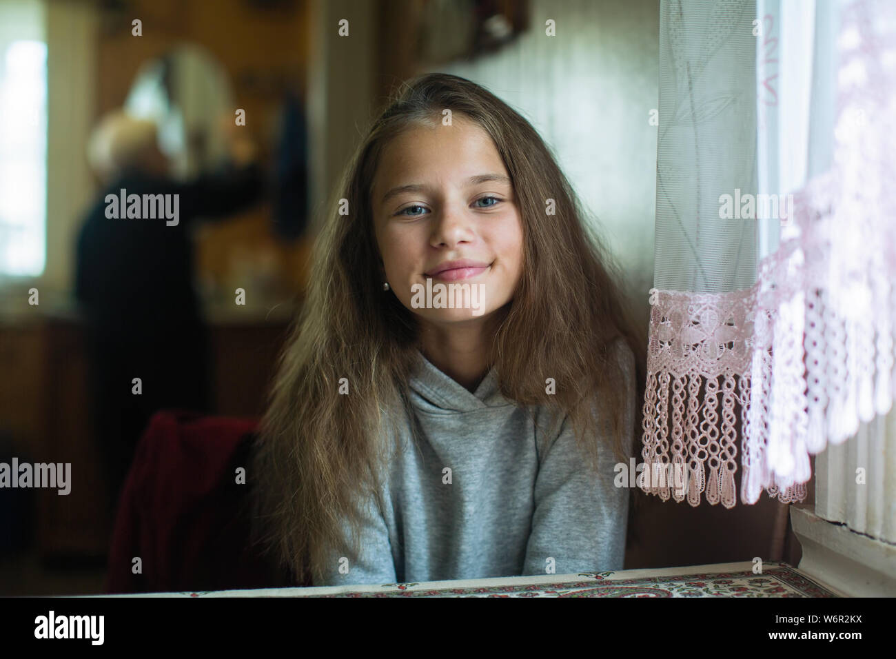 Portrait of a cute little girl in her house Stock Photo - Alamy