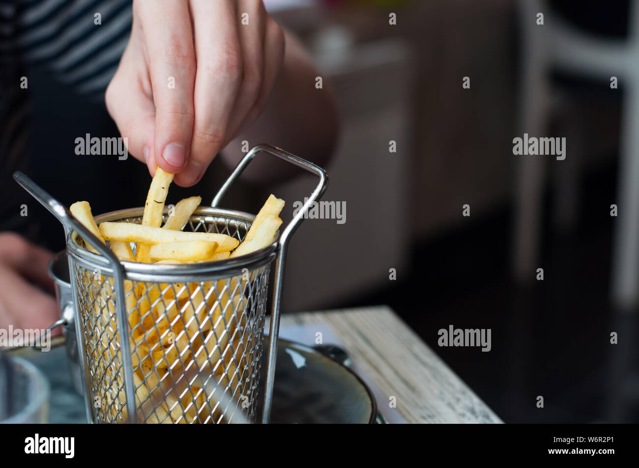 Closeup hand holding fries hi-res stock photography and images - Alamy