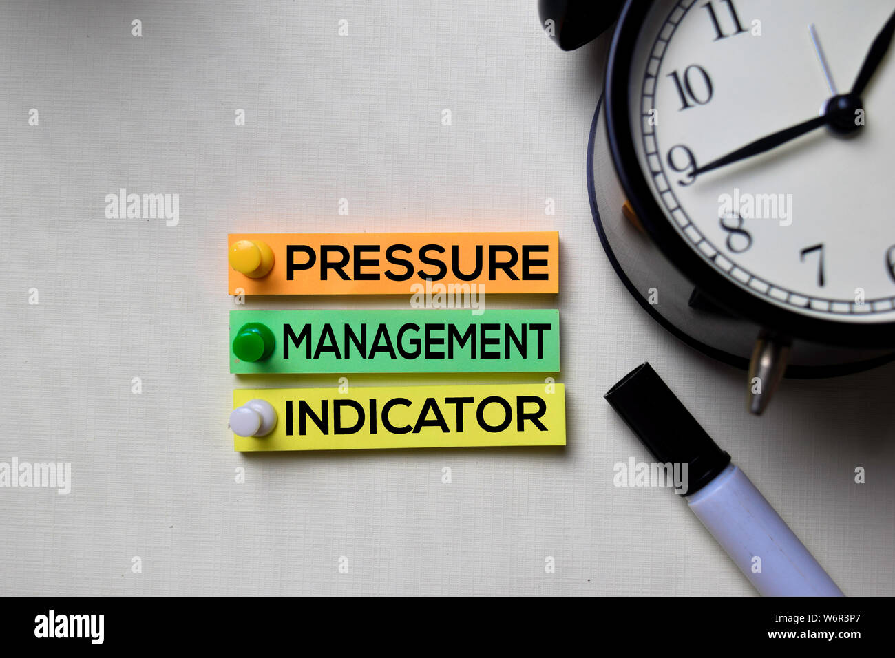 Pressure Management Indicator text on sticky notes isolated on office ...