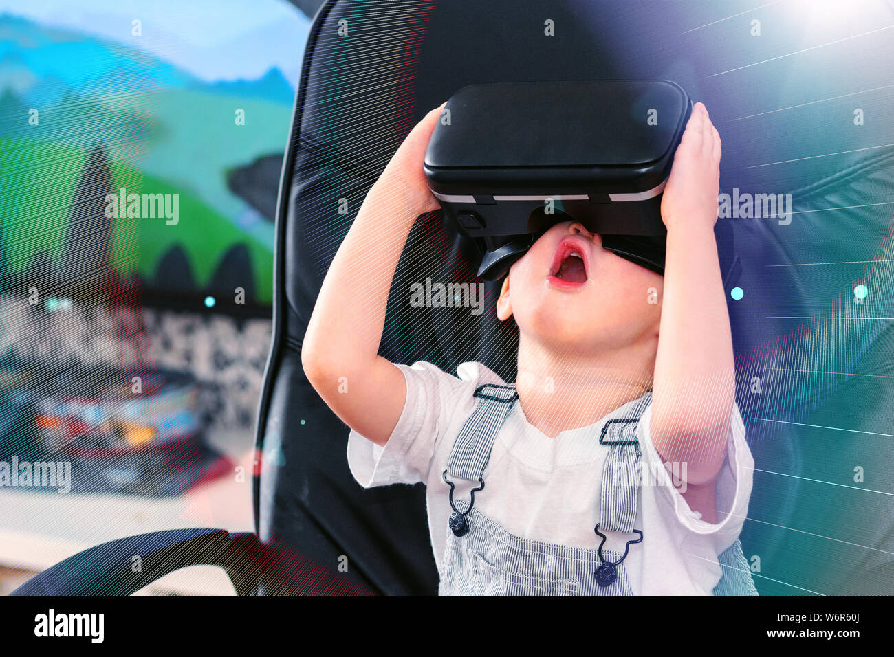 Child using new Virtual Reality, VR cardboard glasses. happy little boy ...