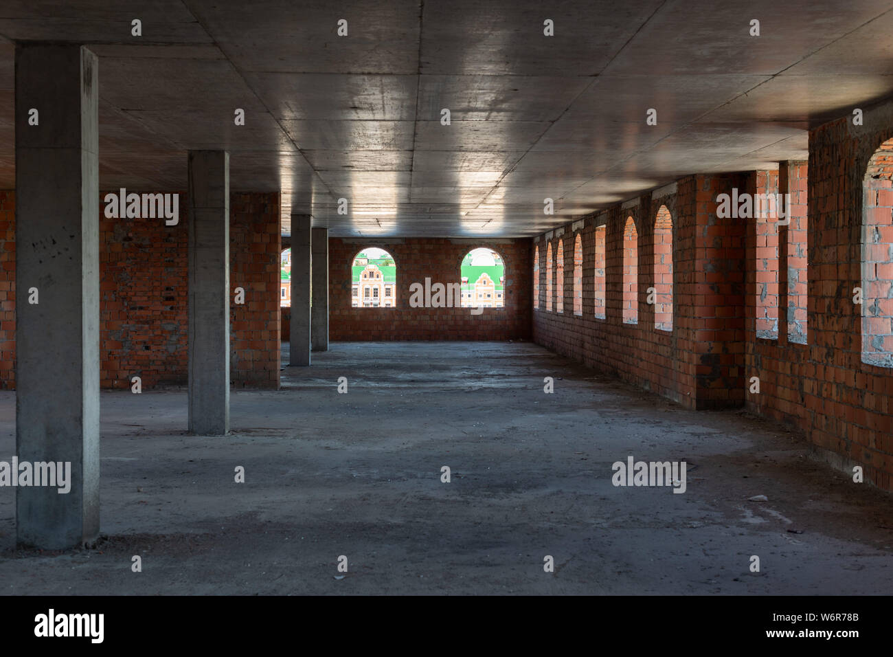 Abandoned haunted house complex. Red brick building interior with semi ...