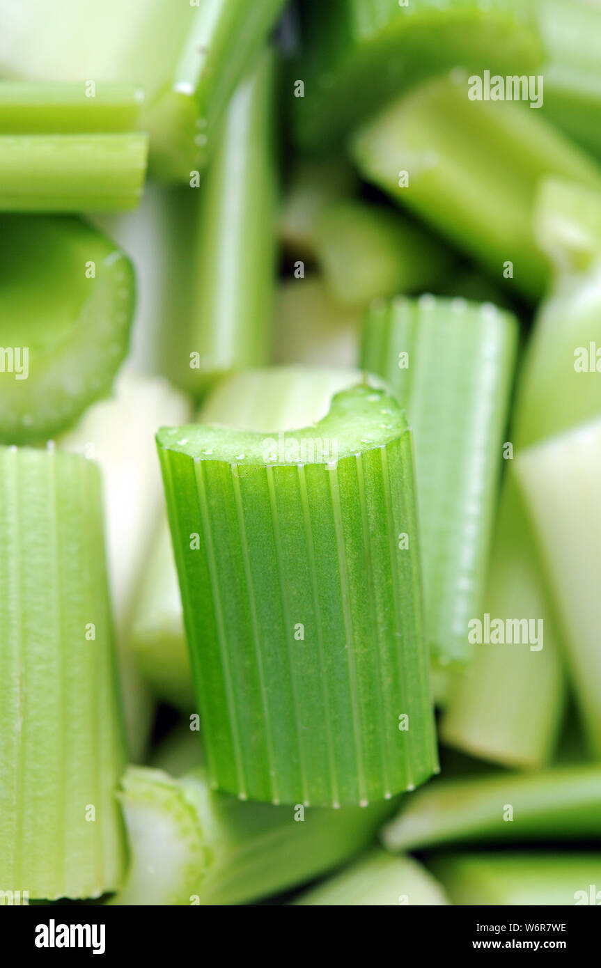 chopped celery on white background Stock Photo - Alamy