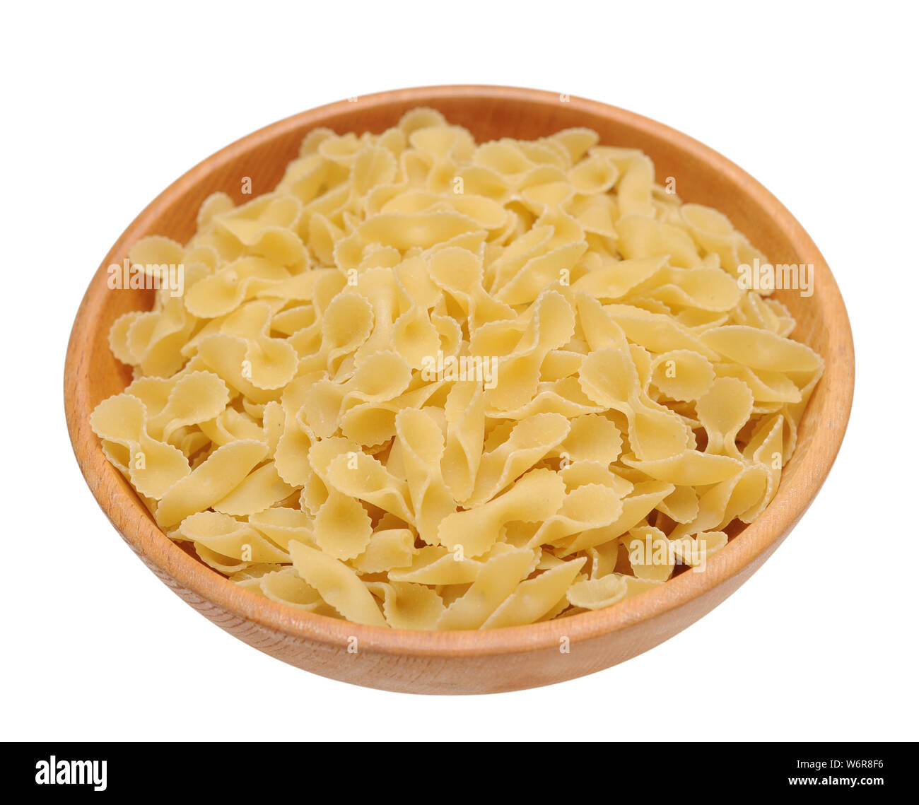 Tripolini tie shape pasta in wooden bowl isolated on white background ...