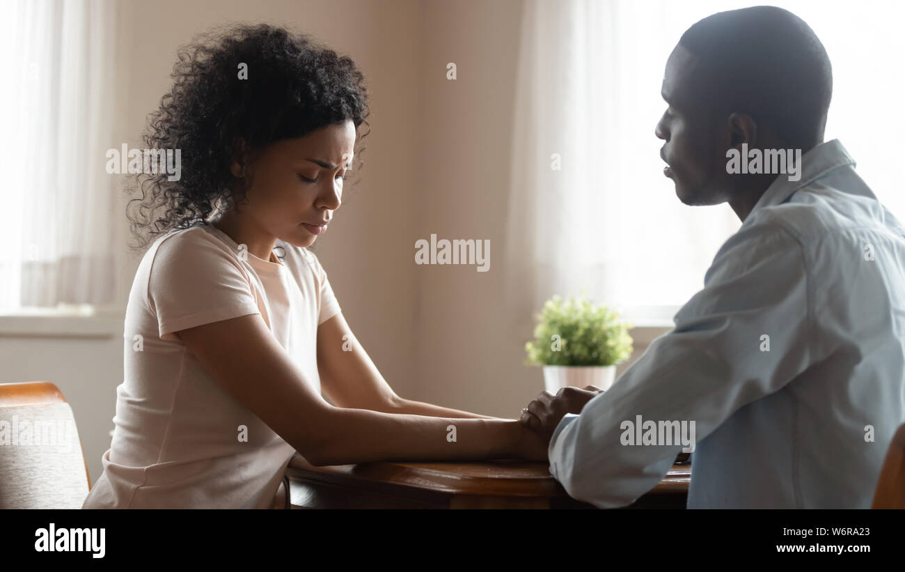 Husband consoling sad wife hi-res stock photography and images - Alamy