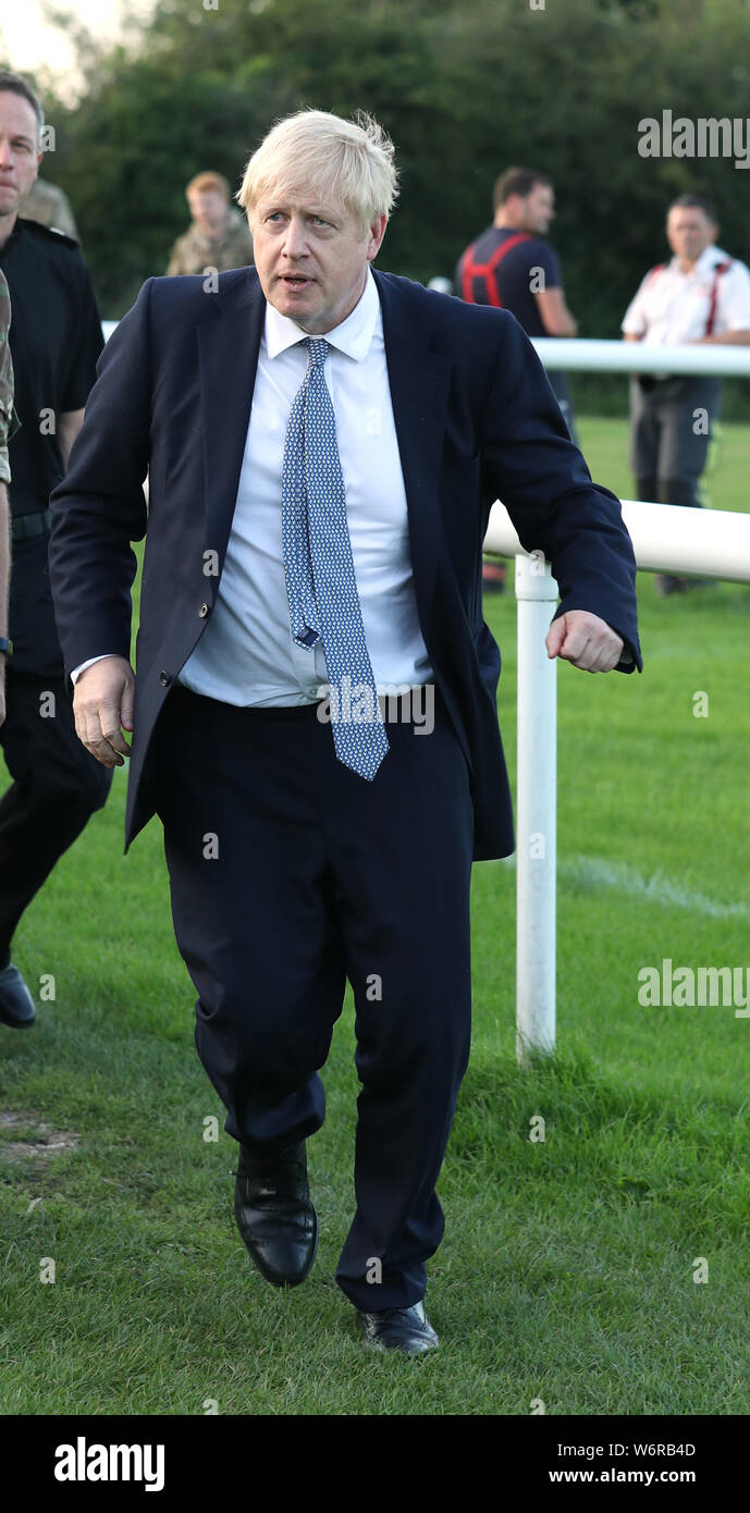 Prime Minister Boris Johnson arrives to meet emergency crews during a ...