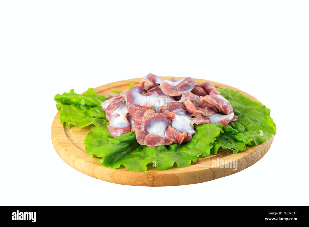 raw chicken gizzards on a white background Stock Photo - Alamy