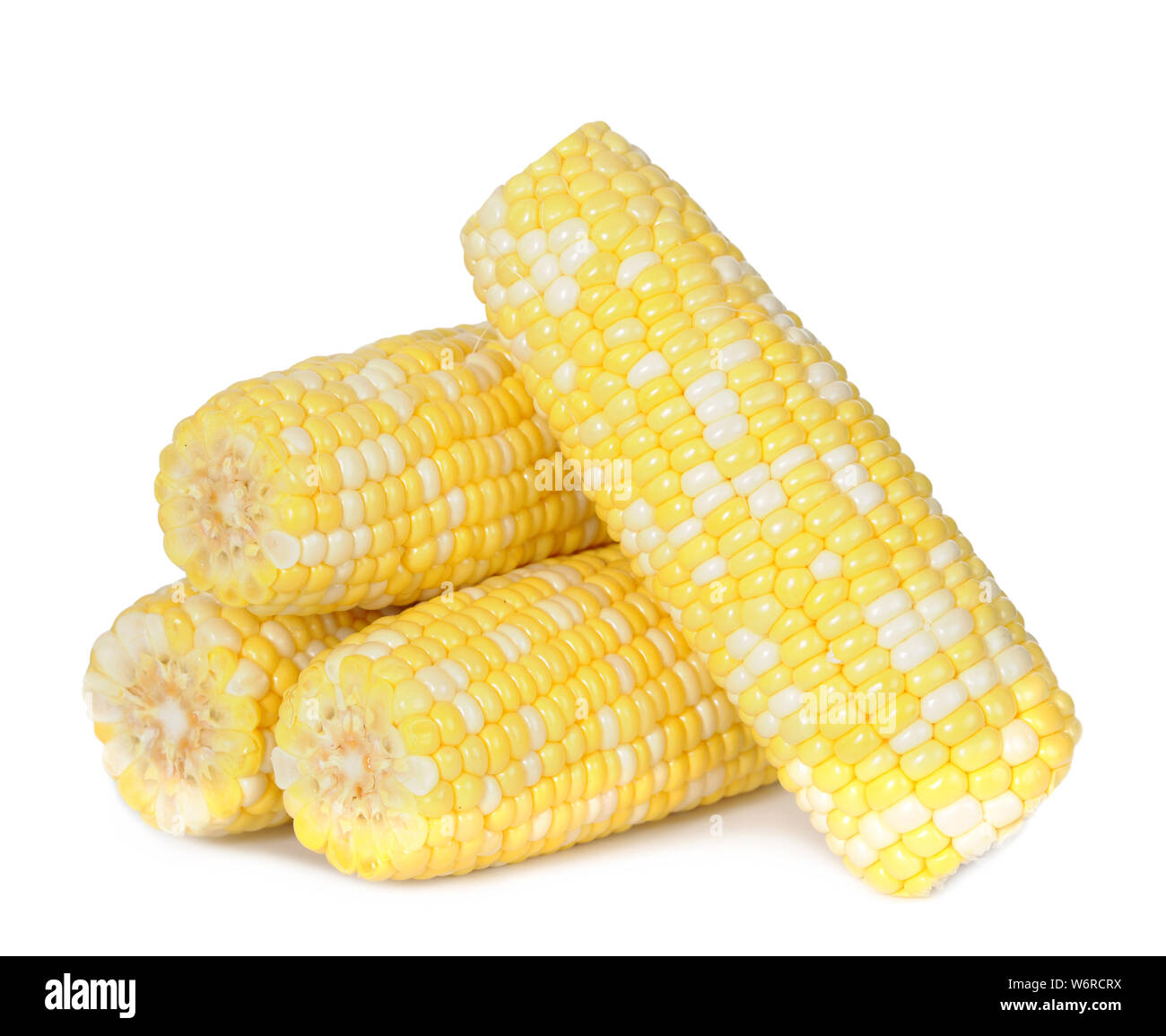 four fresh corns on white background Stock Photo - Alamy