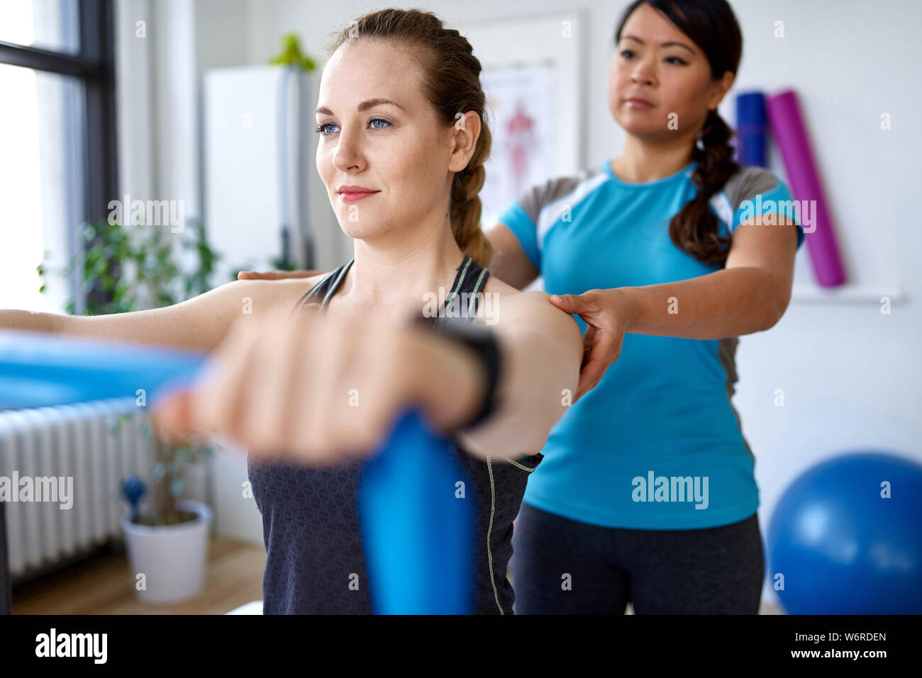 Chinese woman physiotherapy professional giving a treatment by using ...