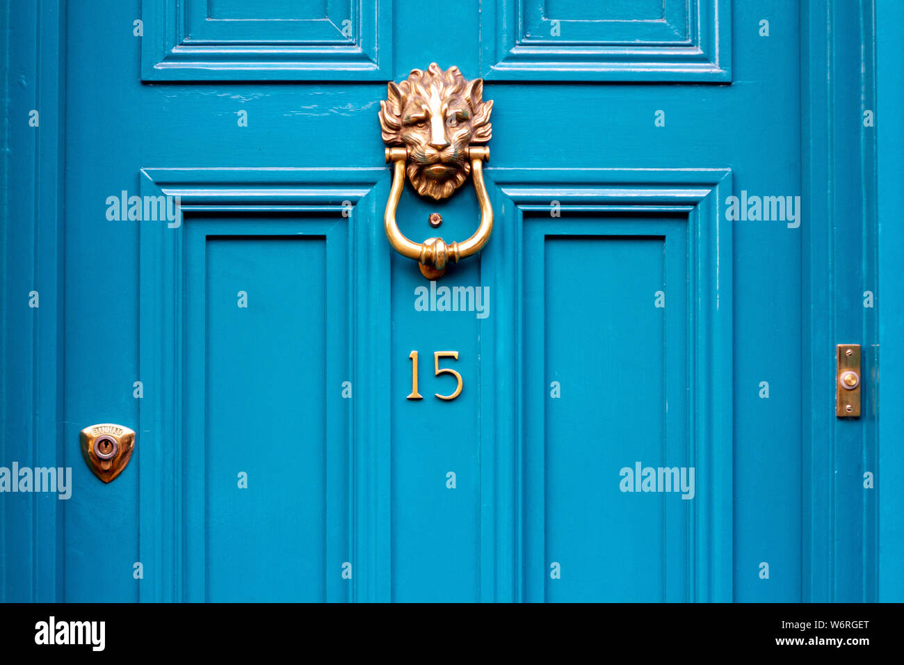 Elegant house number 15 with lion's head door knocker in gold Stock ...