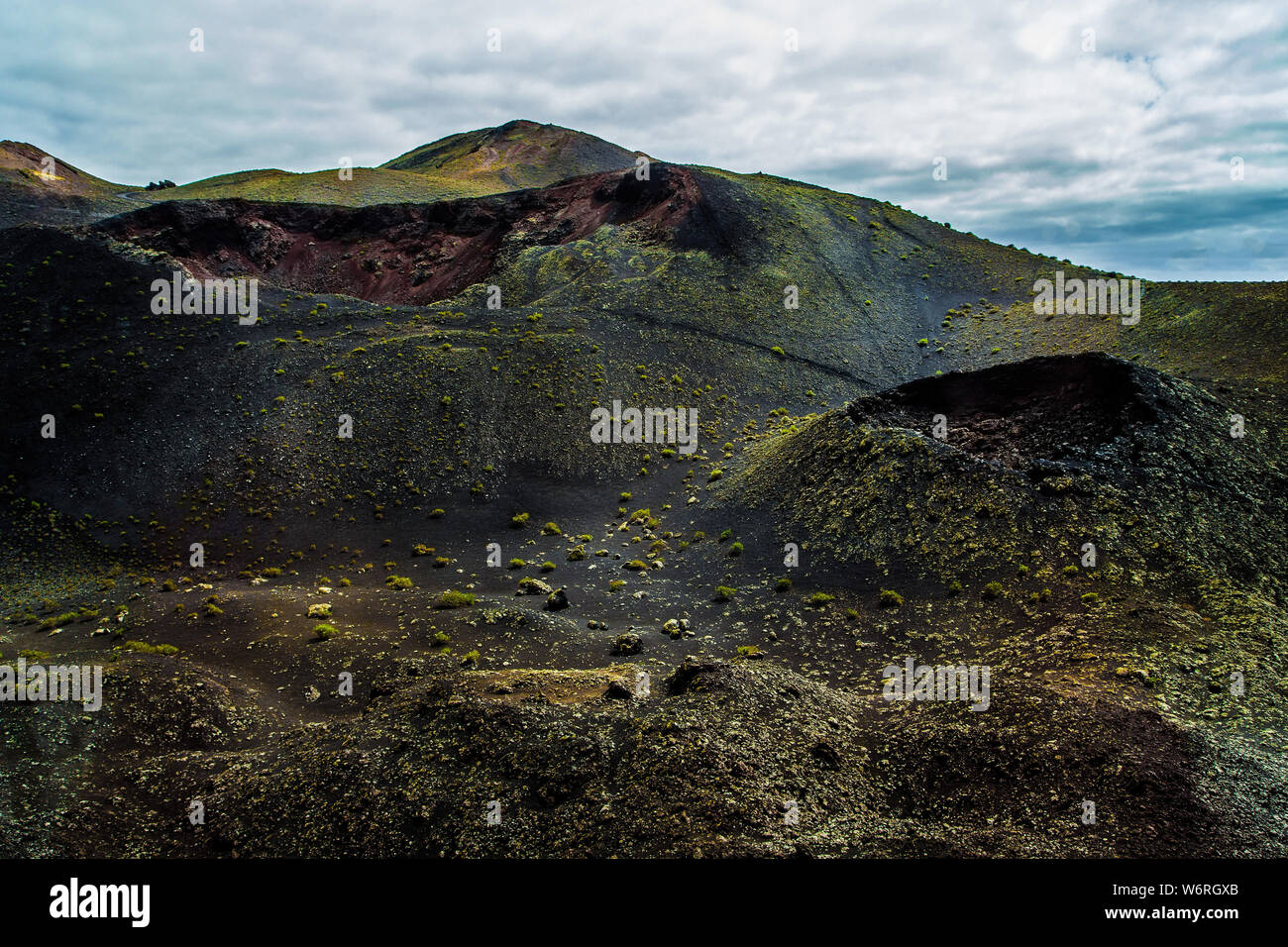 incredibly beautiful volcanoc landscape with black sand and red ...