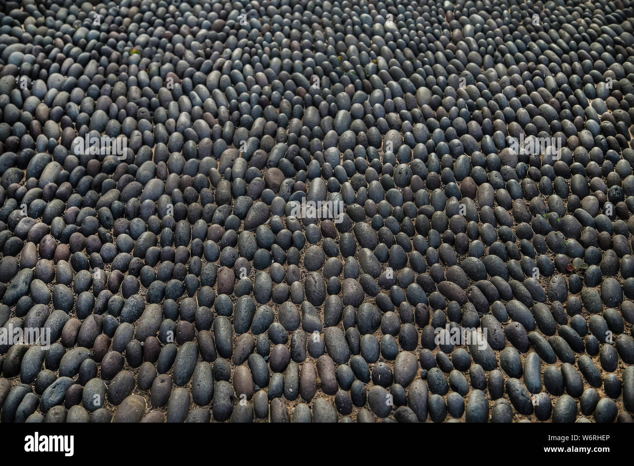 polished stone gray pebble stone pavement Stock Photo - Alamy