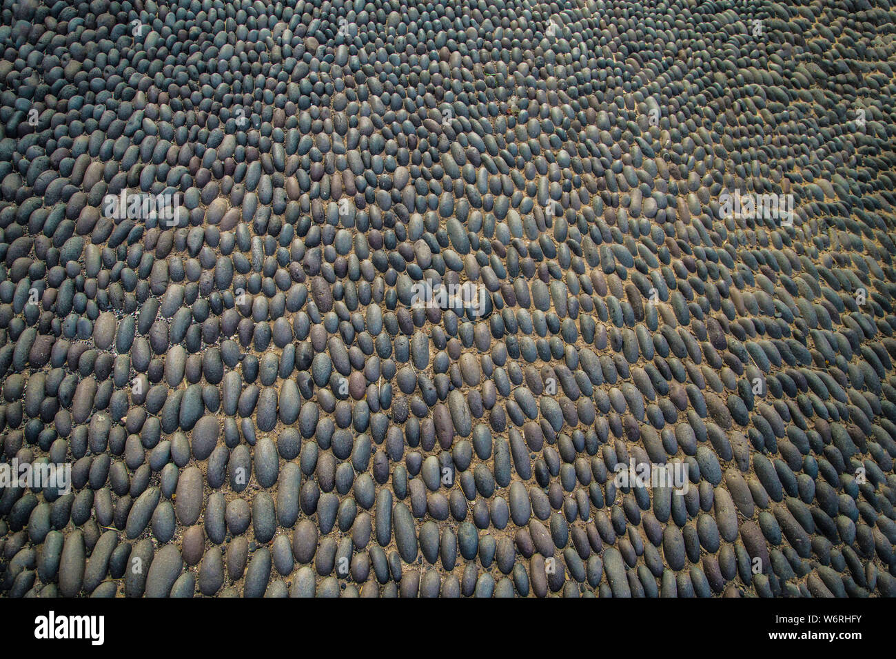 polished stone gray pebble stone pavement Stock Photo - Alamy