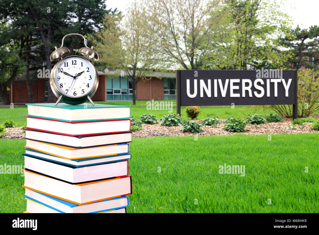 higher education concept with books and university Stock Photo - Alamy