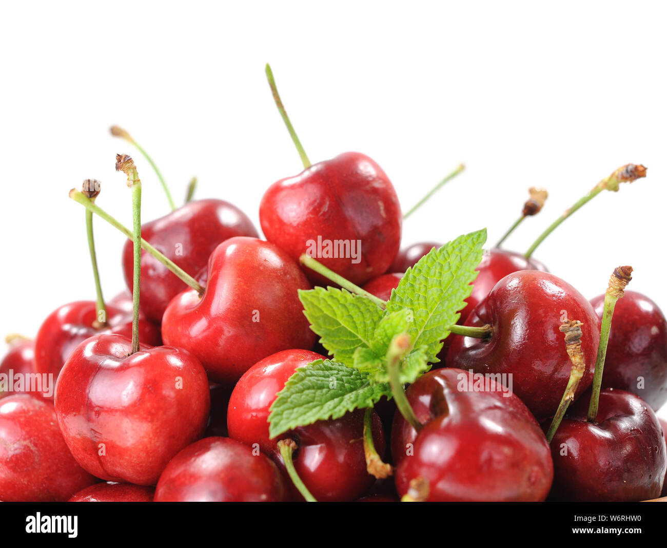closeup fresh cherry isolated on white Stock Photo - Alamy