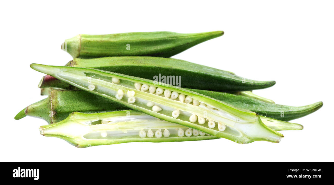 whole and chopped okra Abelmoschus isolated on white background Stock ...