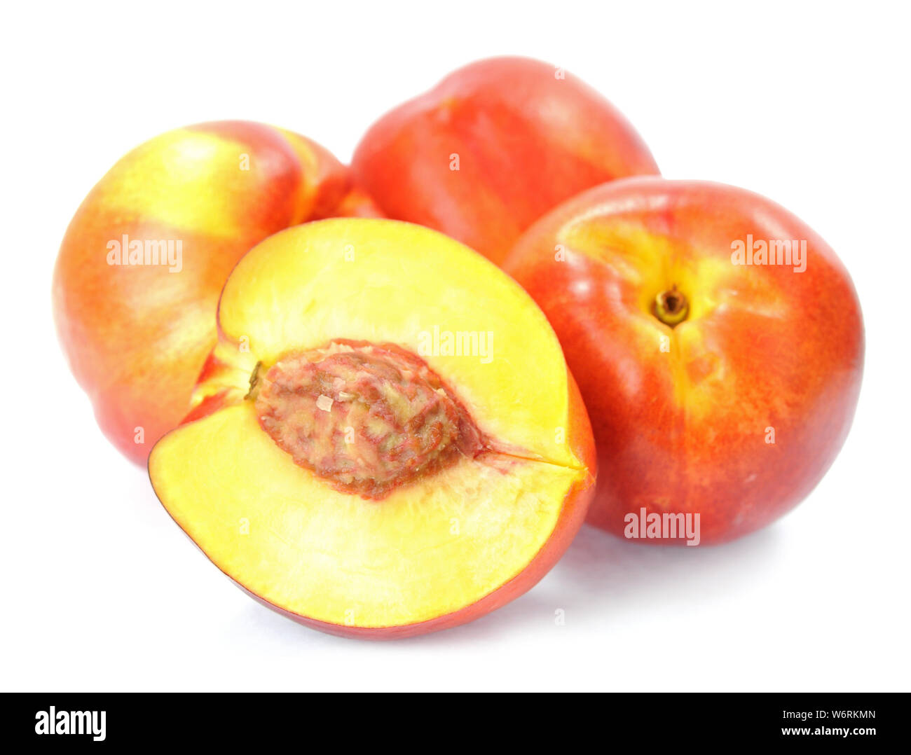 Chopped and whole nectarine on white Stock Photo - Alamy