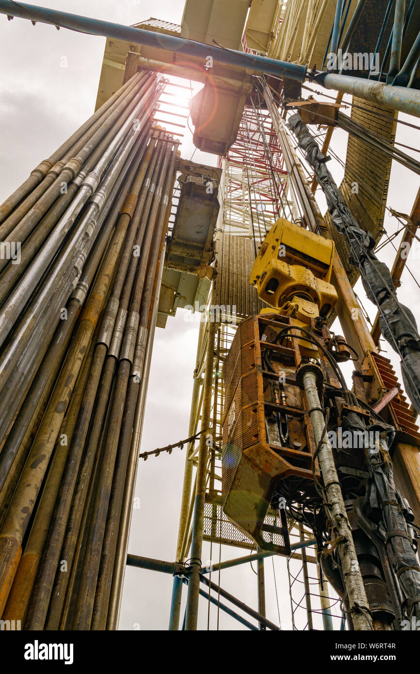 Oil and Gas Drilling Rig onshore dessert with dramatic cloudscape. Oil ...