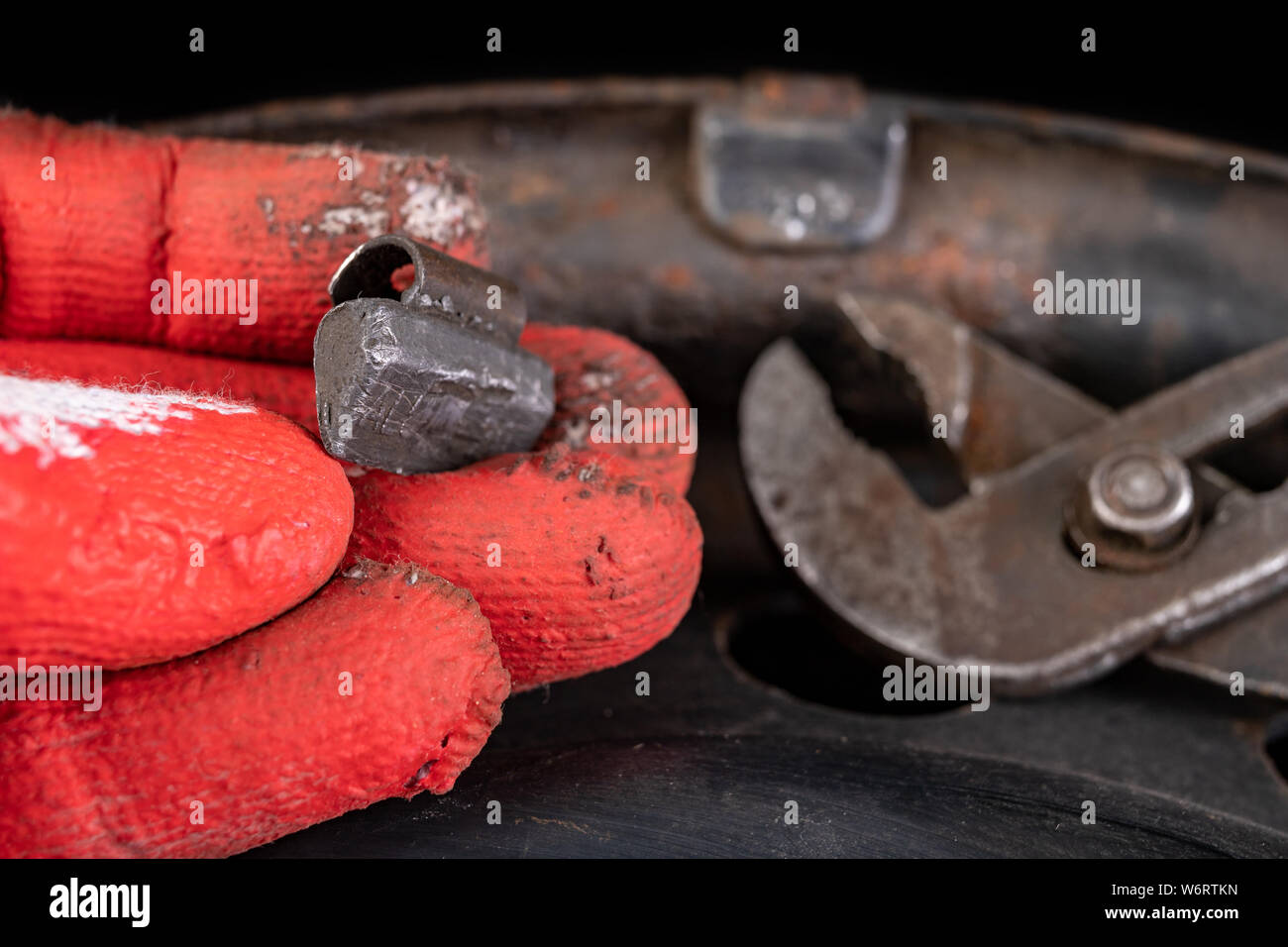 Lead weights on rim and tongs. Accessories for the vulcanizer in the ...