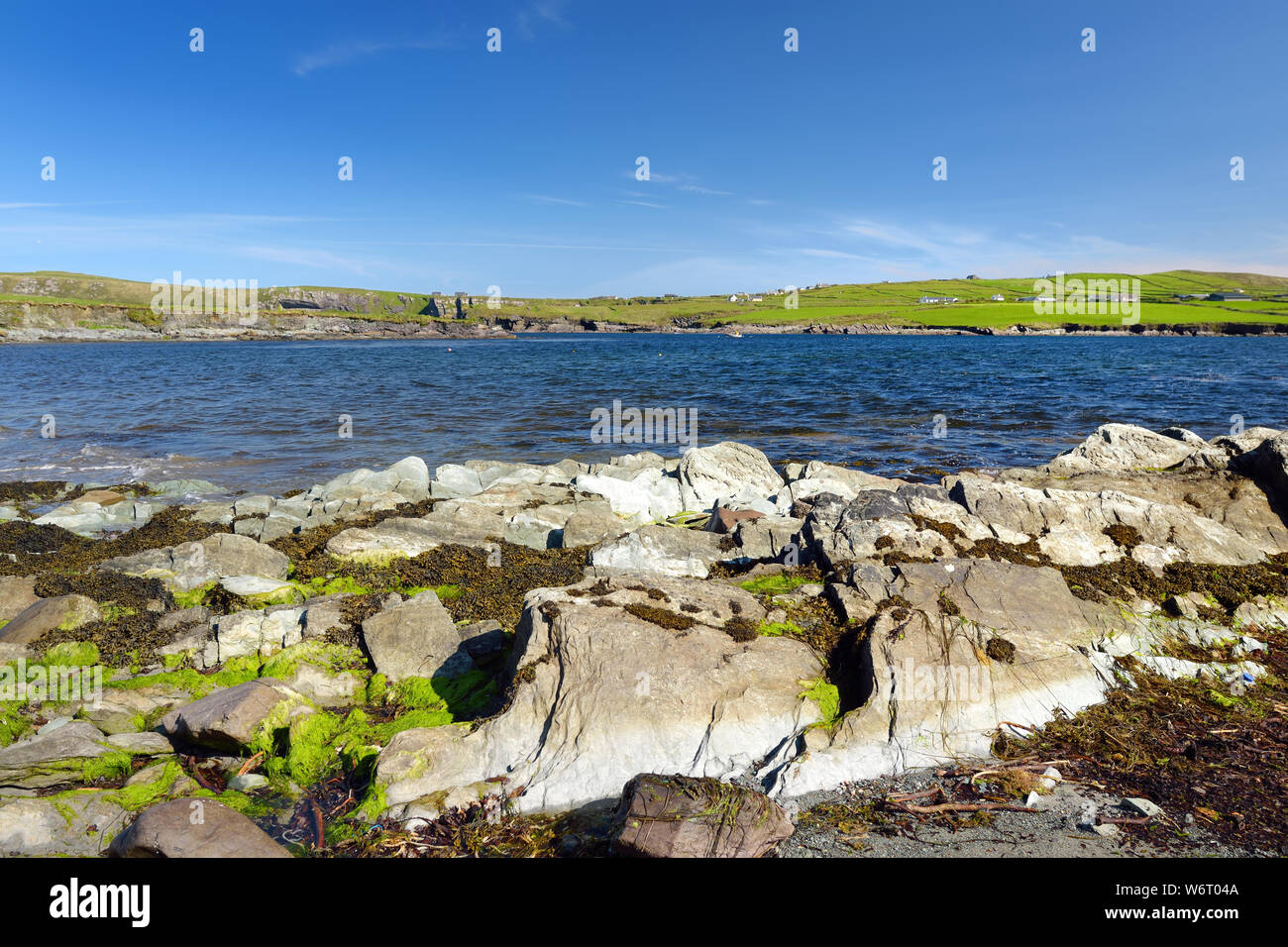 Rough and rocky shore along famous Ring of Kerry route. Rugged coast of ...