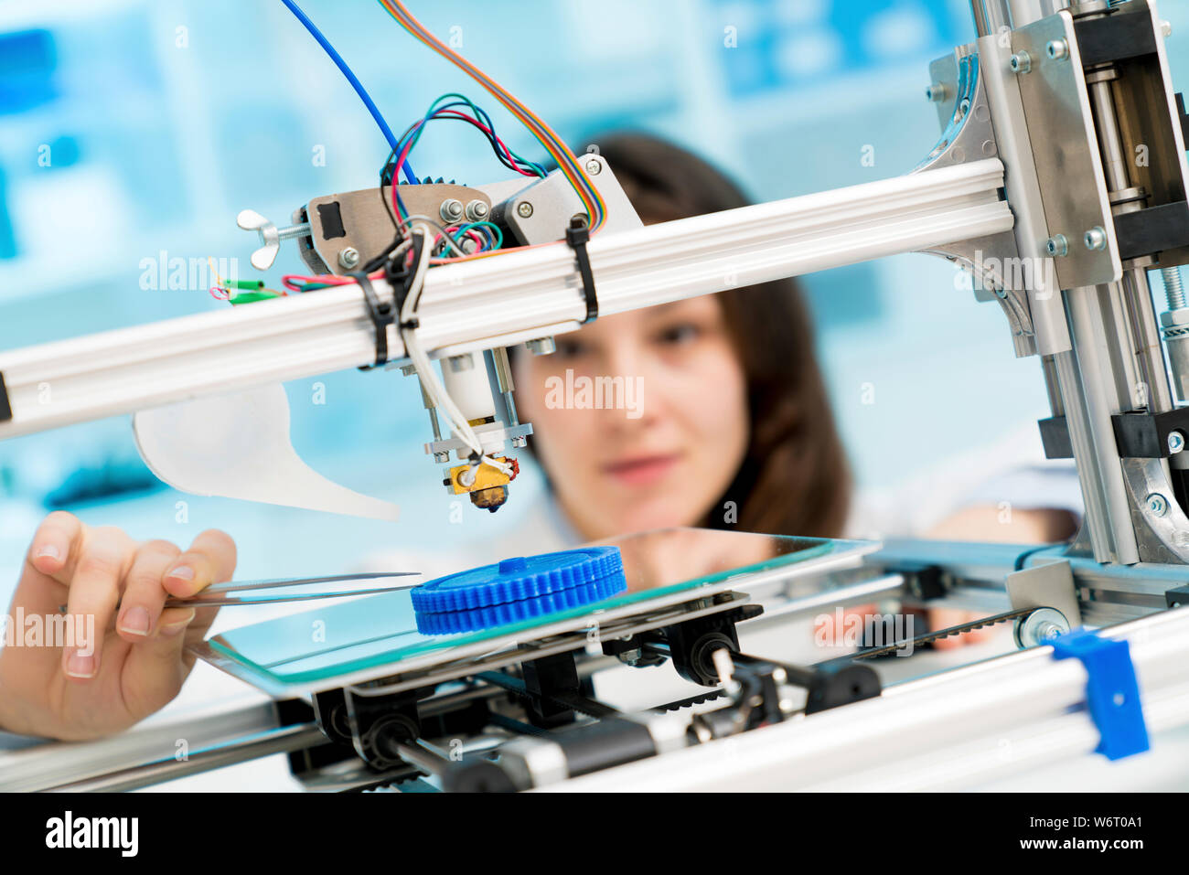 Technician working on 3D printer Stock Photo - Alamy