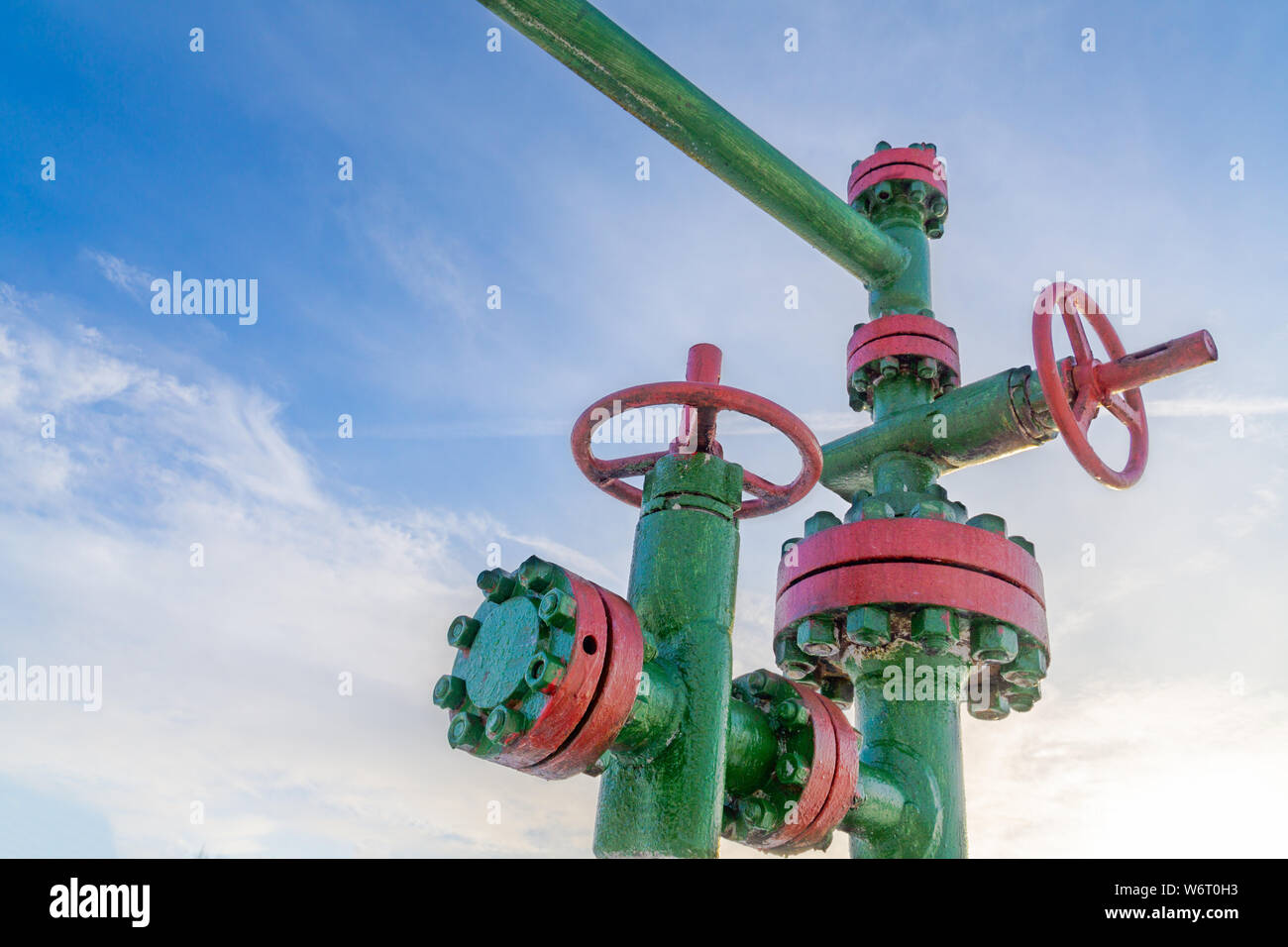 Horizontal view of a wellhead with valve armature. Oil and gas industry ...