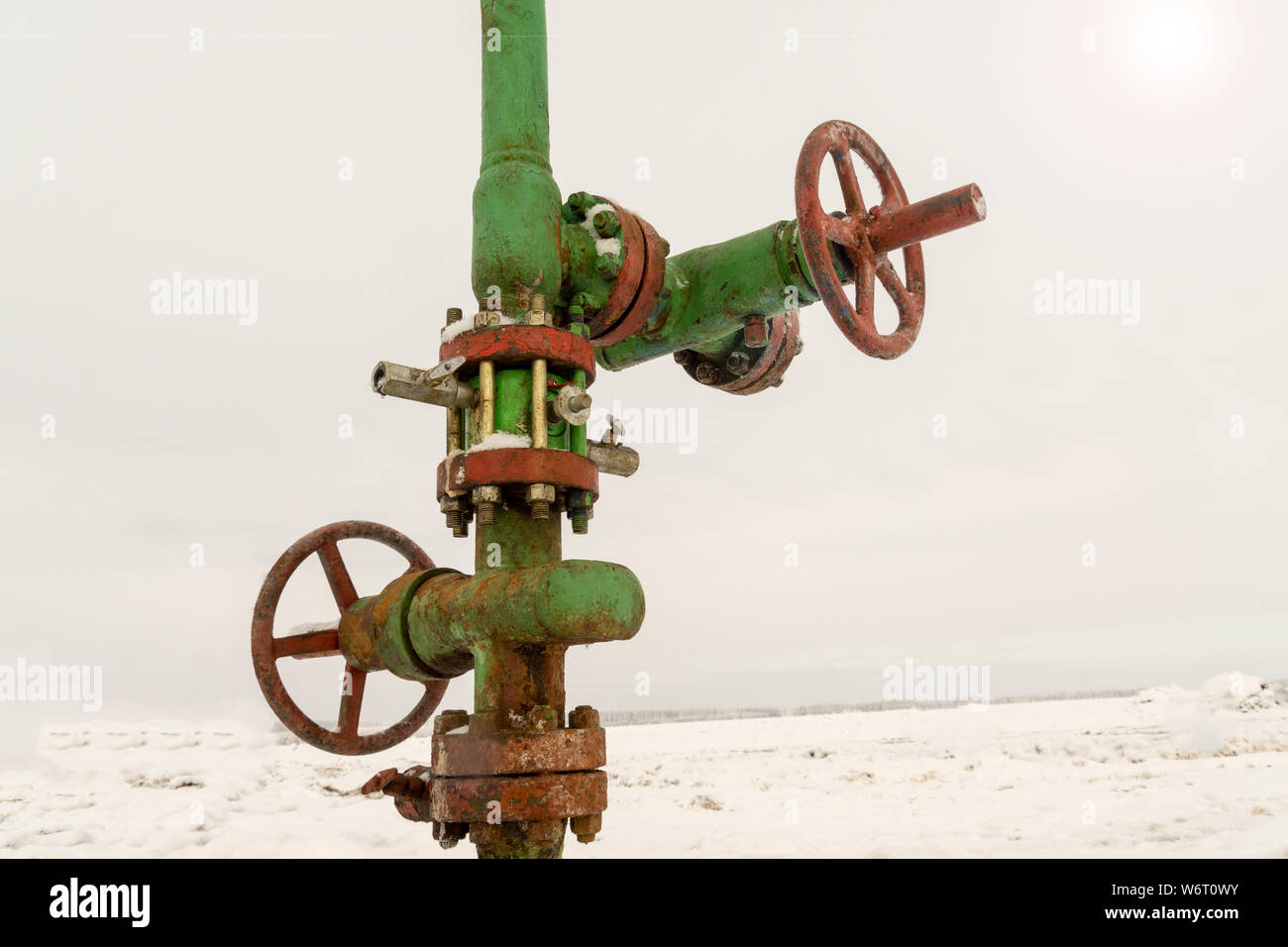 Horizontal view of a wellhead with valve armature. Oil and gas industry ...