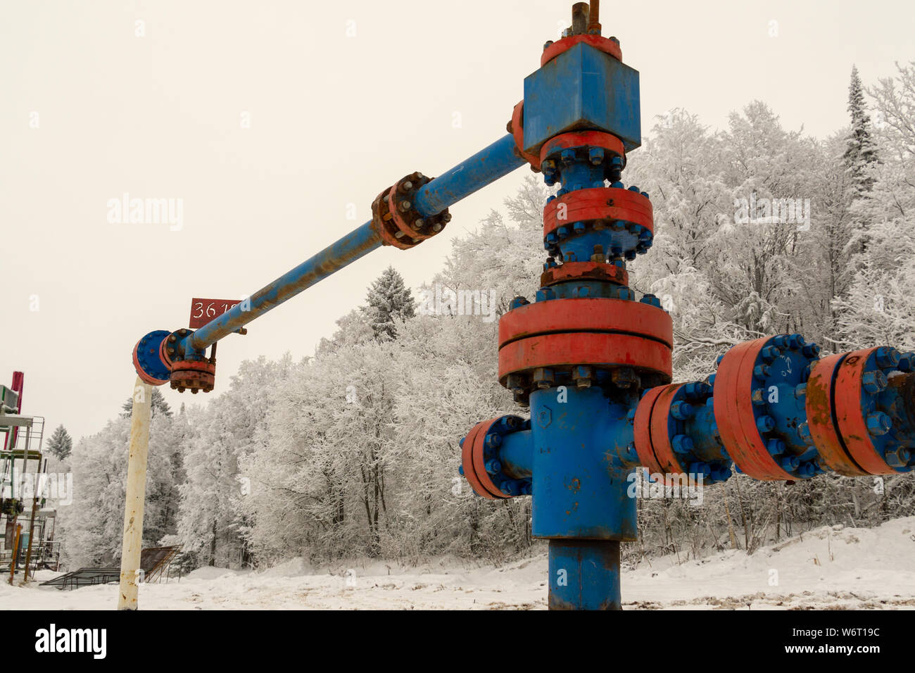 Horizontal view of a wellhead with valve armature. Oil and gas industry ...