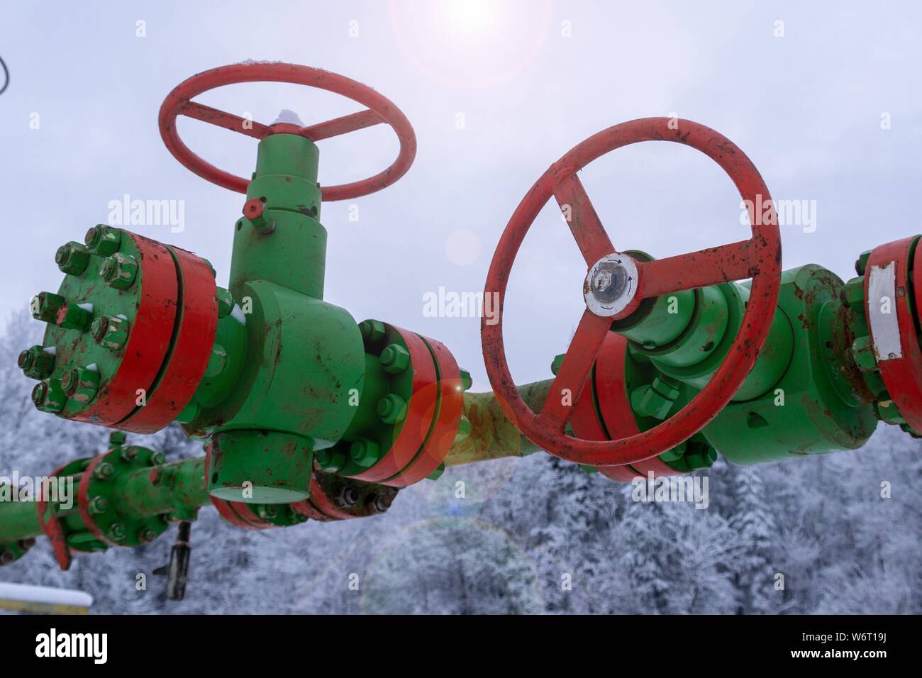 Horizontal view of a wellhead with valve armature. Oil and gas industry ...