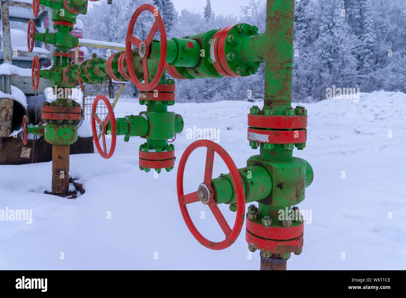 Horizontal view of a wellhead with valve armature. Oil and gas industry ...