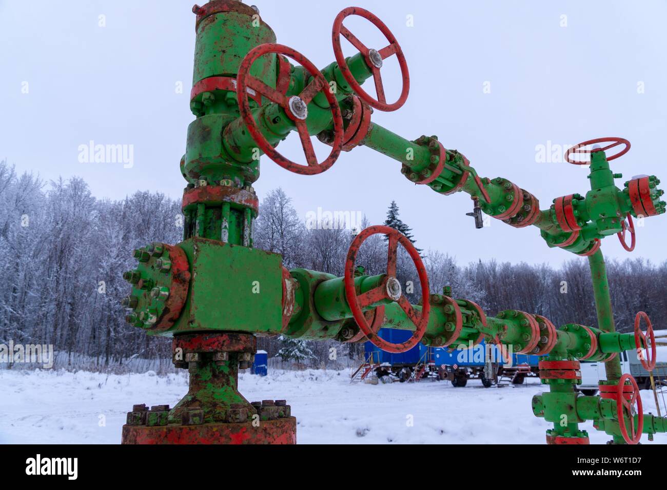 Horizontal view of a wellhead with valve armature. Oil and gas industry ...