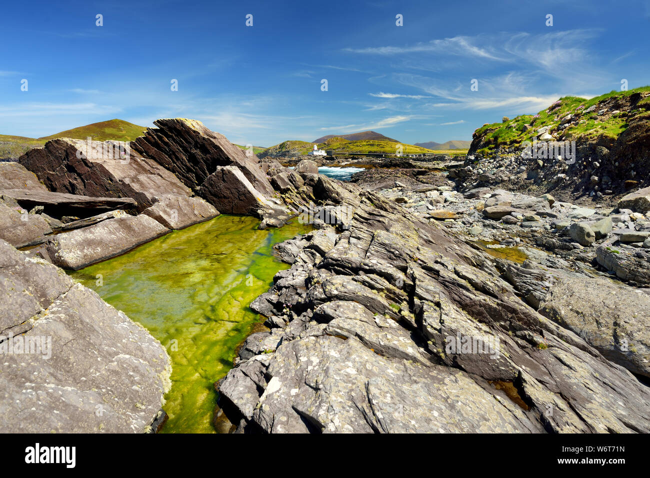 Rough and rocky shore along famous Ring of Kerry route. Rugged coast of ...