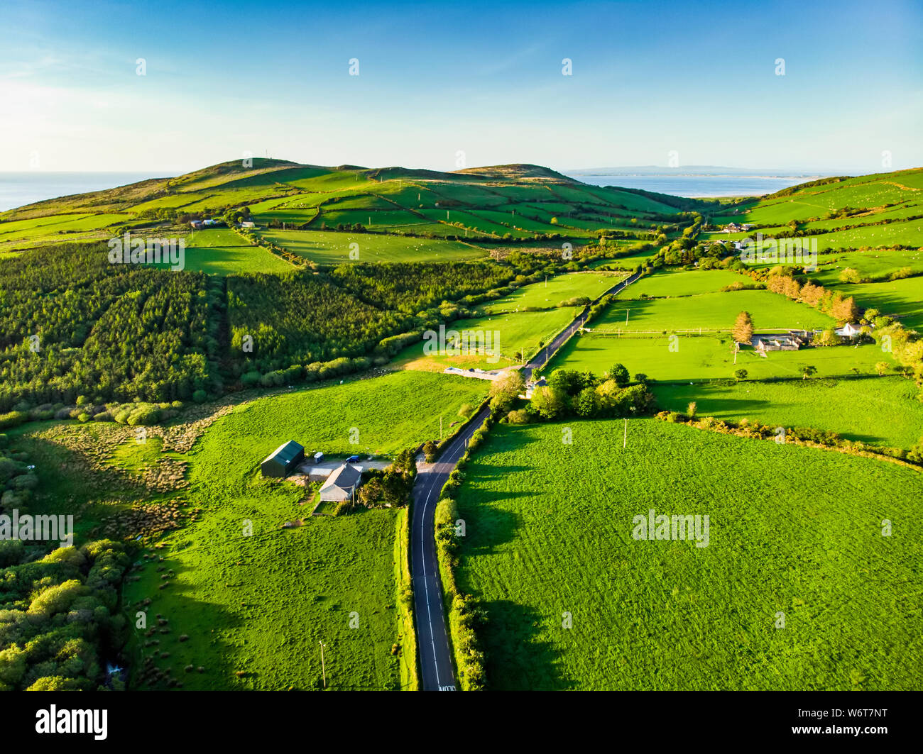 Aerial view of endless lush pastures and farmlands of Ireland ...